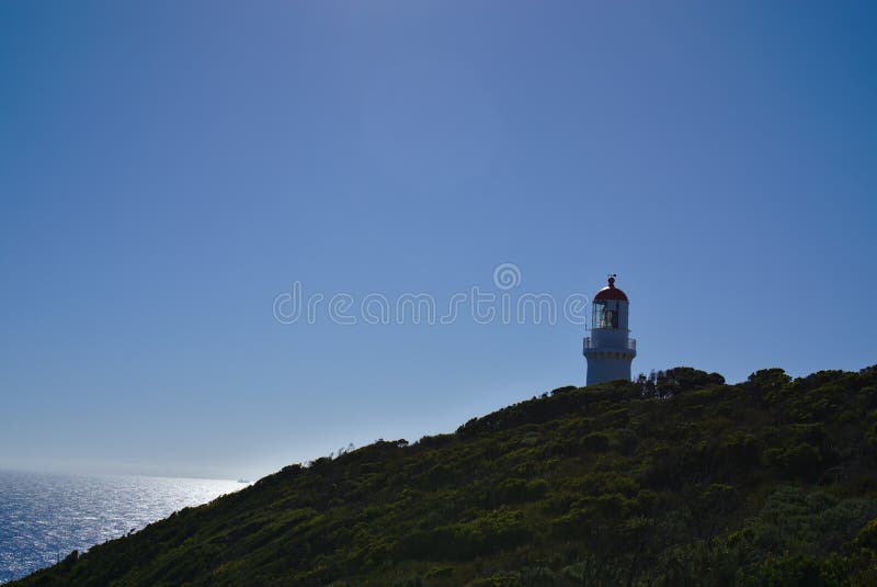 Distant view of lighthouse stock image. Image of peaceful - 141375051