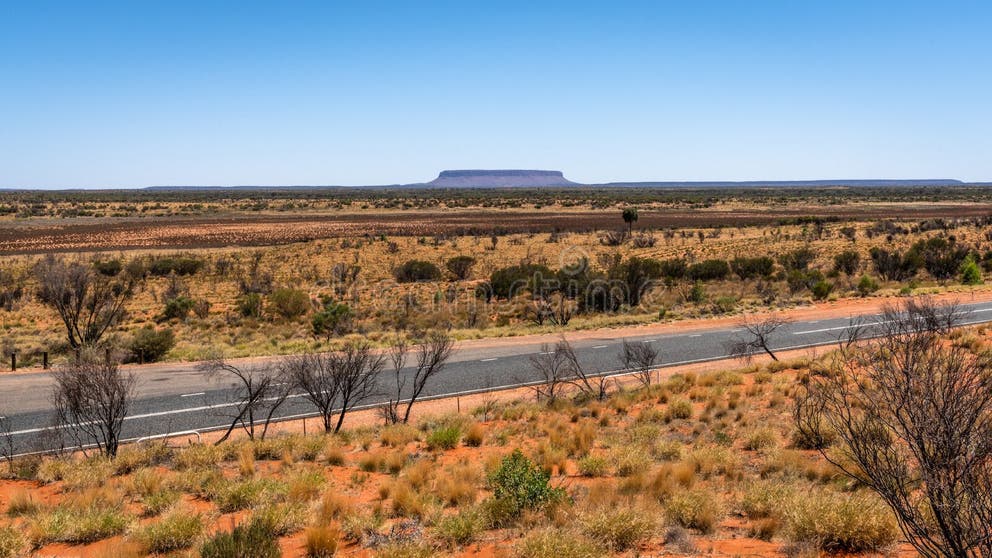 Distant View of Mount Conner with Lasseter Highway in Central Outback ...