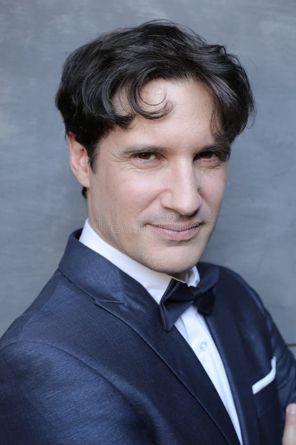 Distinguished Looking Man Wearing a Suit and a Bowtie Stock Image ...