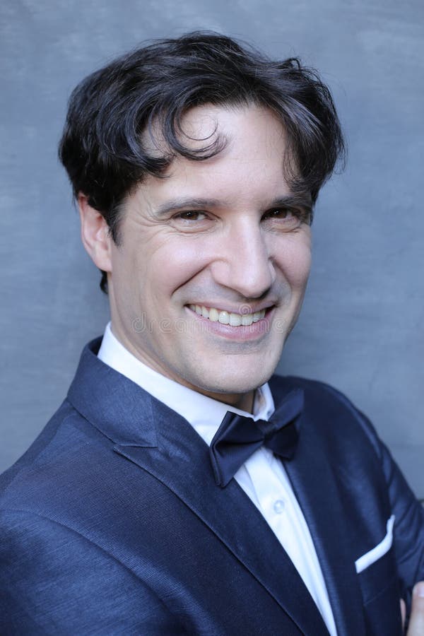 Distinguished Looking Man Wearing a Suit and a Bowtie Stock Photo ...