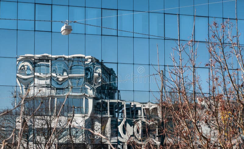 The Distorted Reflection of a Building in a Glass Facade Stock Photo ...