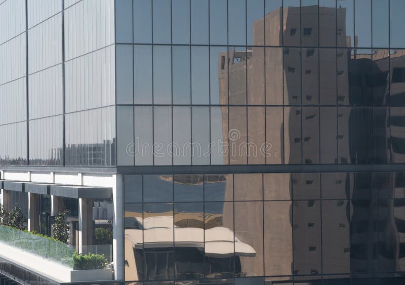 Distorted Reflection of Residential Buildings in the Glass Reflective ...