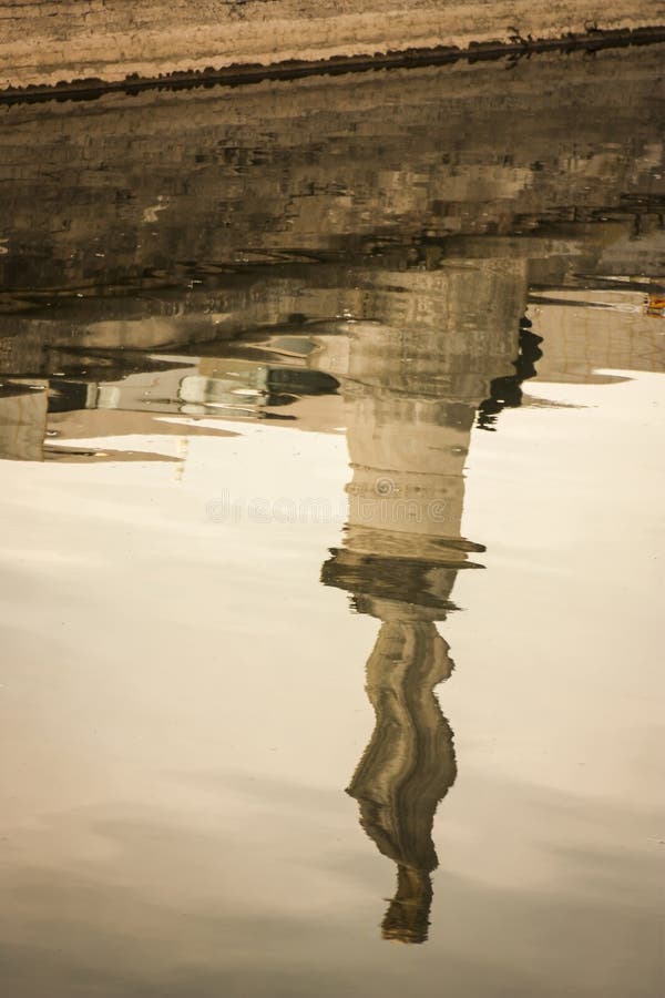 Distorted Reflection of Industrial Chimney in Water with Ripples ...