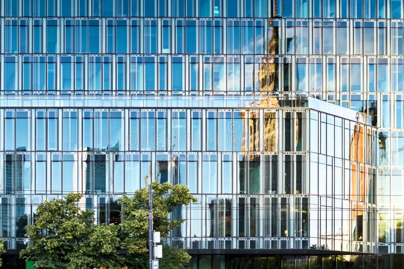 Distorted Reflections of Skyscrapers in the Glass Facade of a Modern ...