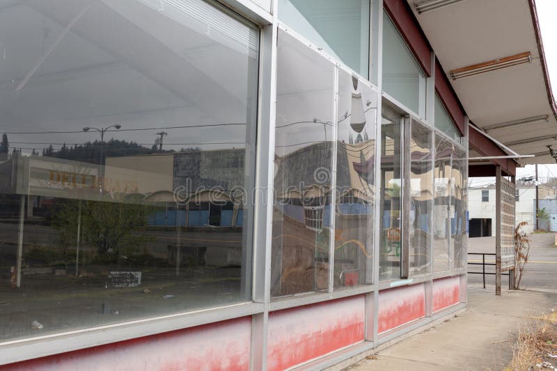 Distorted Reflections in the Windows of an Abandoned Grocery Store ... Distorted Reflections in the Windows of an Abandoned Grocery Store ...