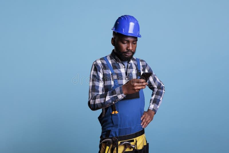 African American Construction Worker Using Cell Phone Stock Image ...