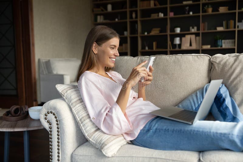 Distracted from Computer Work Happy Woman Using Cellphone. Stock Photo ...