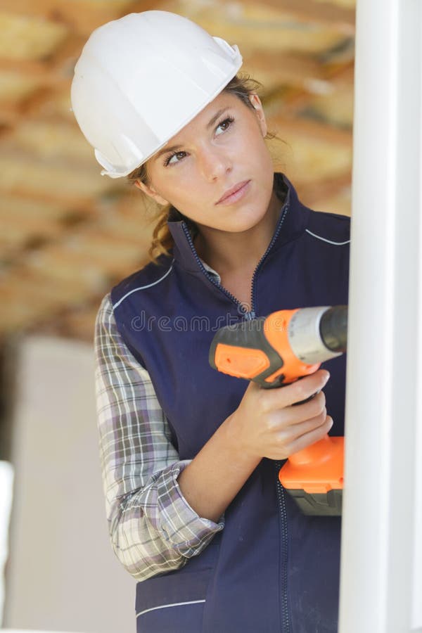 Distracted Female Builder Using Cordless Drill Stock Image - Image of ...