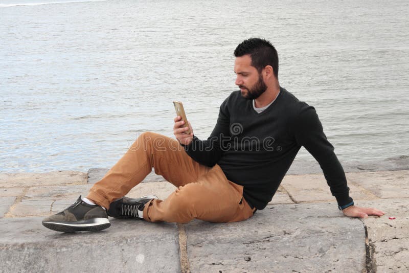 Distracted Man by the River, Lisbon, Portugal Stock Image - Image of ...
