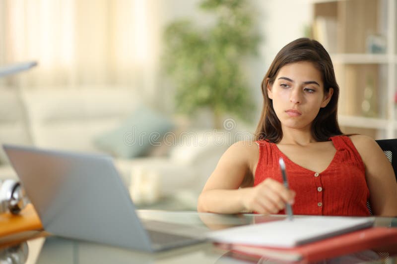 Distracted Student Waiting Looking at Laptop Stock Photo - Image of ...
