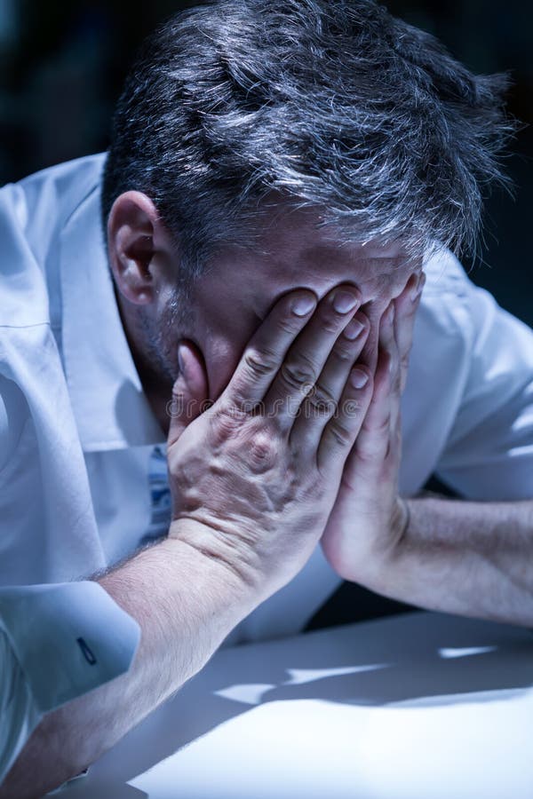 Distraught Man in the Office Stock Photo - Image of office, loneliness ...