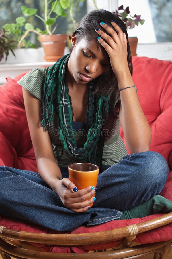 Distraught Woman Sitting on Chair Stock Photo - Image of american ...