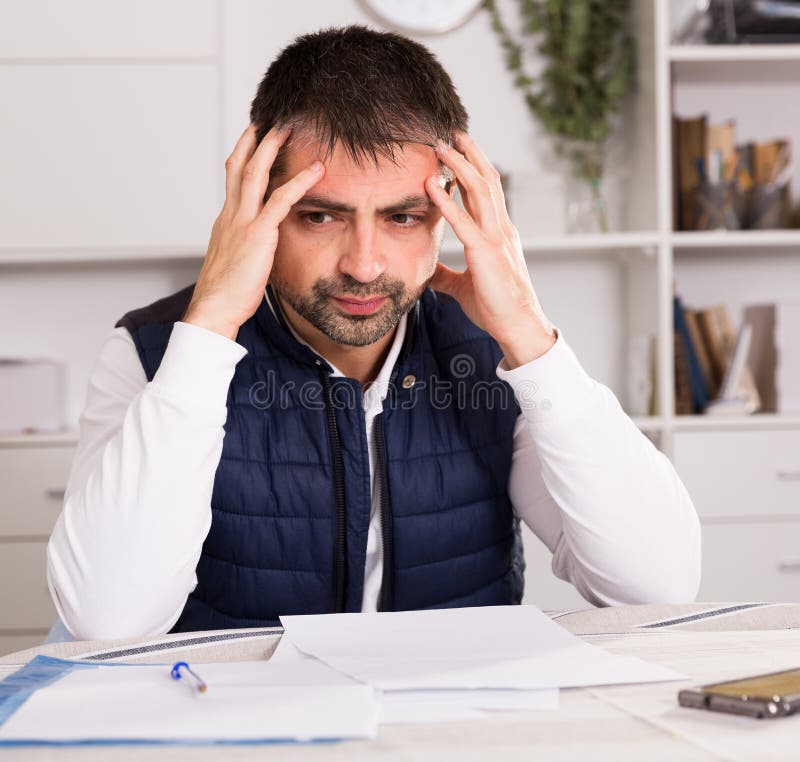 Distressed Male Having Problems with Paying Utility Bills Stock Photo ...