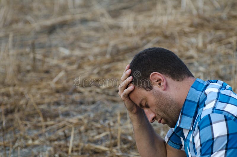 Man Praying with His Head Down Outside in Nature. Stock Image - Image ...