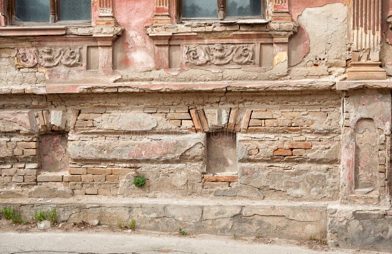 The Distressed Surface of the Old Buildingâ€™s Exterior with an Antique ...