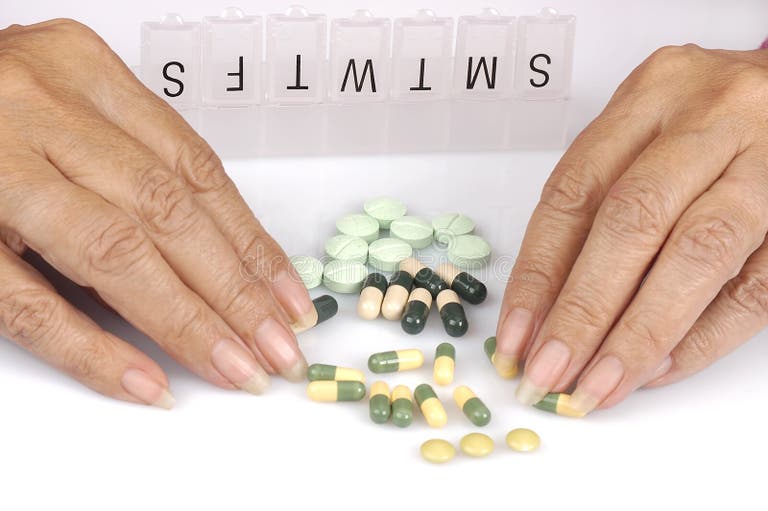 Distributing Medication into a Pill Dispenser Stock Photo - Image of ...