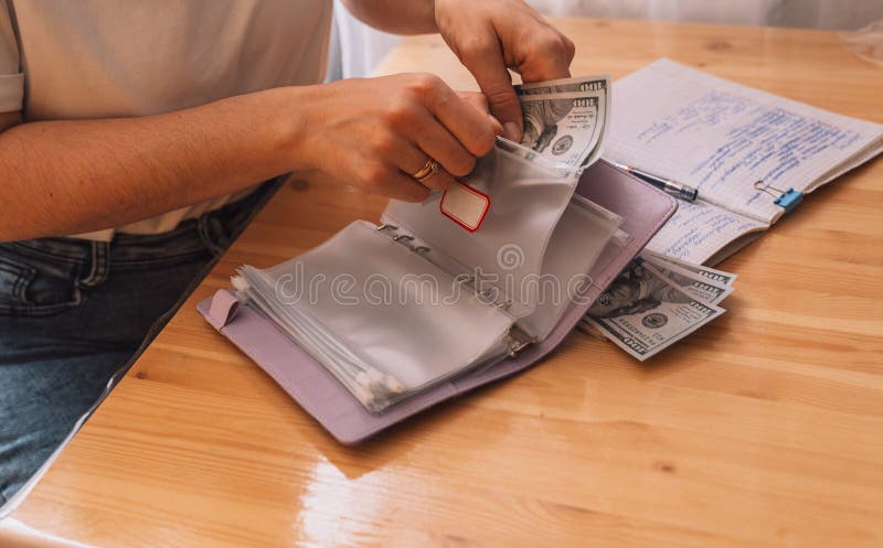 Distribution of Money among Different Zip Bags in a Notepad Stock Photo ...