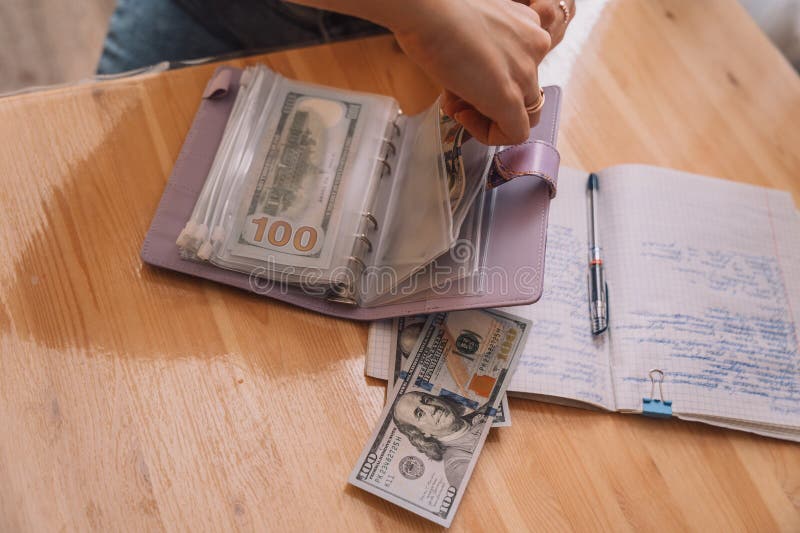 Distribution of Money among Different Zip Bags in a Notepad Stock Photo ...