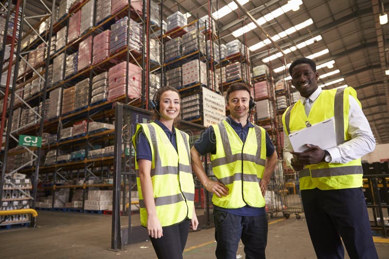 Group Portrait of Staff at Distribution Warehouse, Low Angle Stock ...