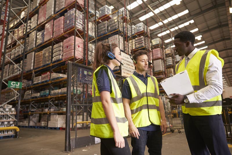 Distribution Warehouse Manager in Discussion with Colleagues Stock ...