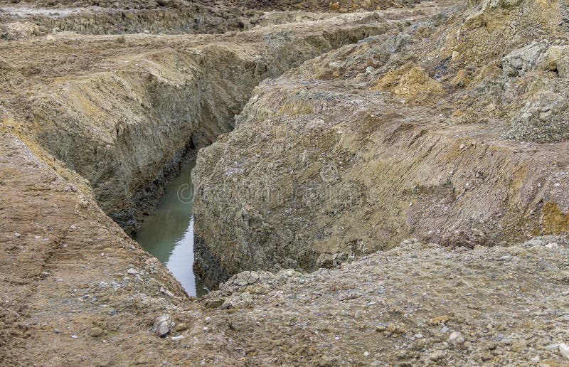 Ditch with water stock photo. Image of excavation, works - 117958160