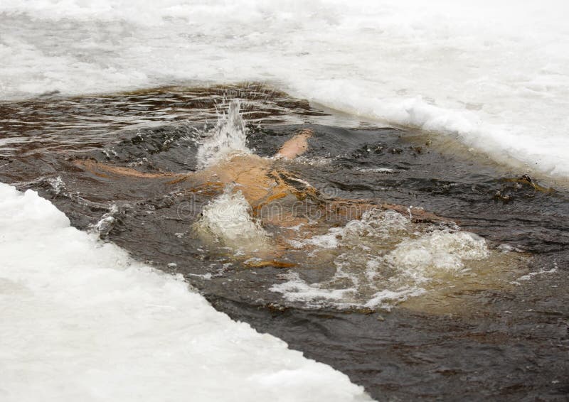 Dive in the Ice-hole. Someone is Jumping into Cold Water Stock Image ...