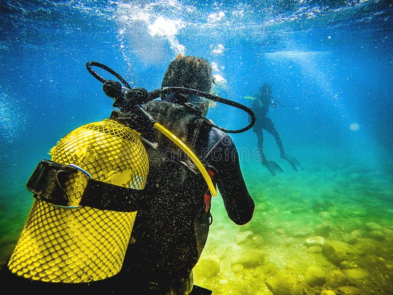 Diver Back To Camera, Looking To Another Diver in the Sea. Stock Image ...