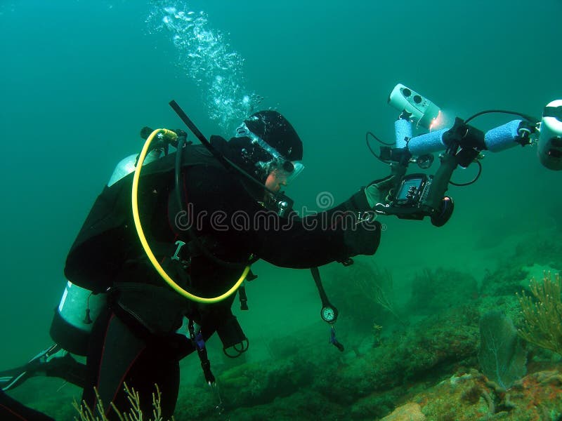 Diver with camera in deep stock image. Image of exotic - 2812267