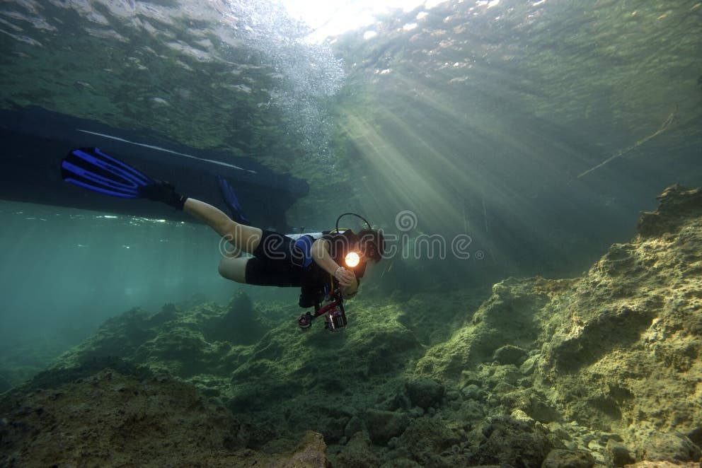 Diver, Diveboat & Sunbeams Stock Image - Image of stones, girl: 12176335