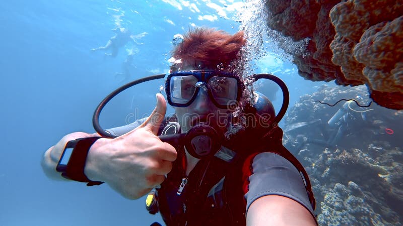 Diver Looks at the Camera and Gives a Thumbs Up Stock Image - Image of ...