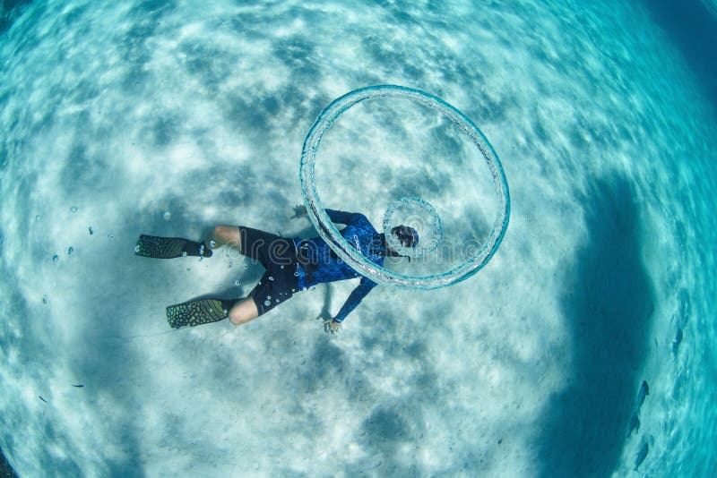 Diver Making Circle Rings Under the Water Stock Photo - Image of mask ...