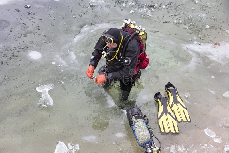 Diver Preparing for the Ice-diving Under the Frozen Surface of L Stock ...