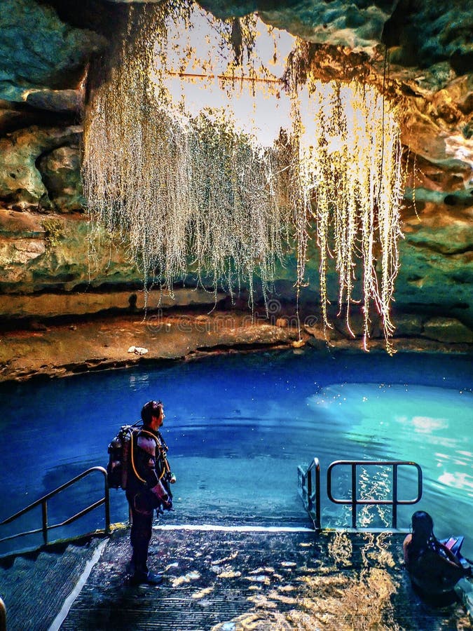 Diver Stands on a Platform in an Underground Cavern at Devil S Den ...