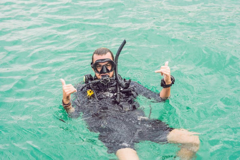 Divers on the Surface of Water Ready To Dive Stock Photo - Image of ...