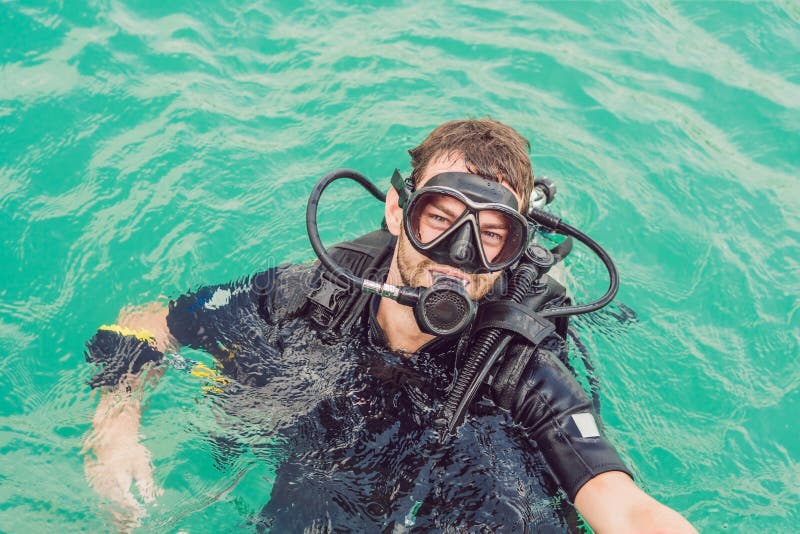 Divers on the Surface of Water Ready To Dive Stock Image - Image of ...