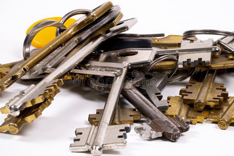 Collection of Various Keys on a White Background with Bright Highlights ...