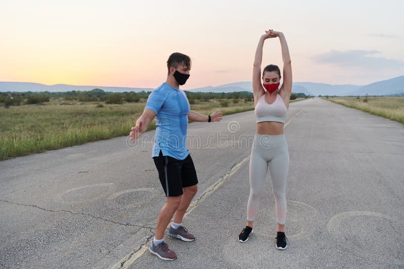 Diverse Athletic Warm-Up: Group Prepares for Intense Running Challenge ...