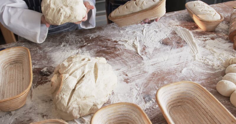 Diverse Bakers Working in Bakery Kitchen, Cutting Dough for Bread in ...