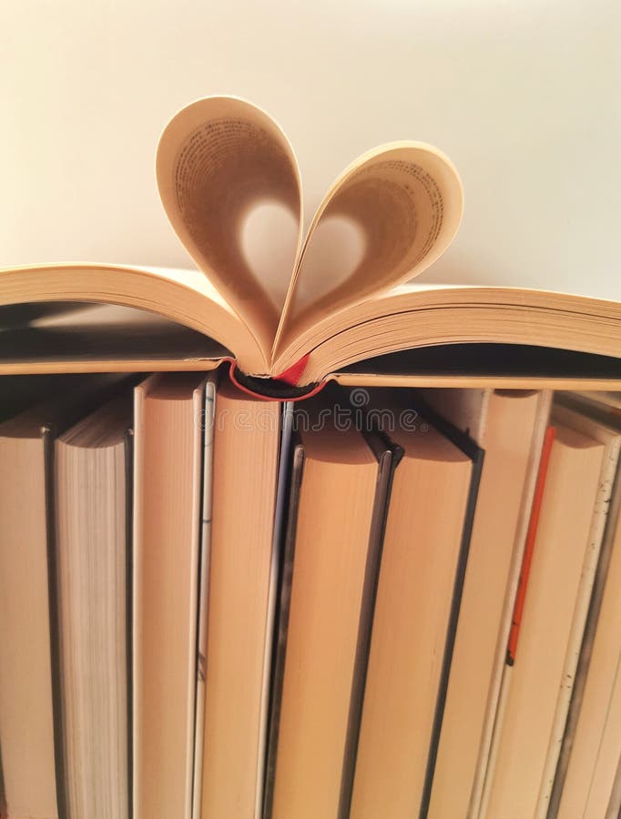 Diverse Books with One Open Book and Curled Leaves in the Shape of a ...