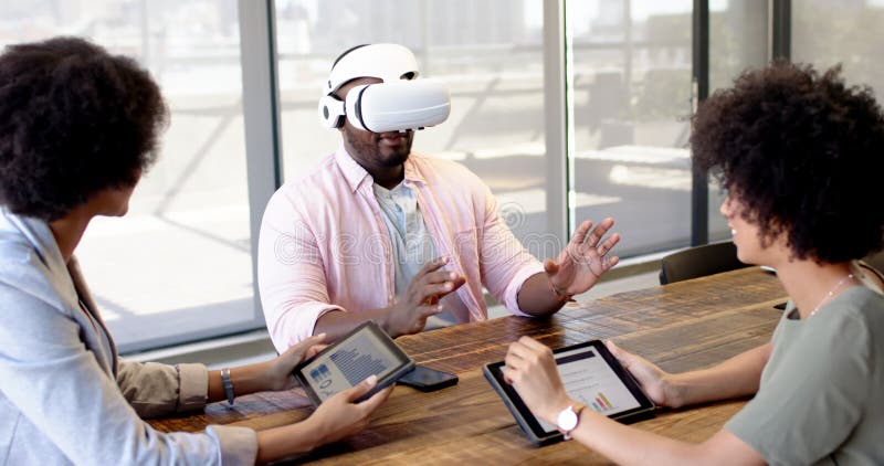 Diverse Business Colleagues Using VR Headset in Modern Office Setting ...