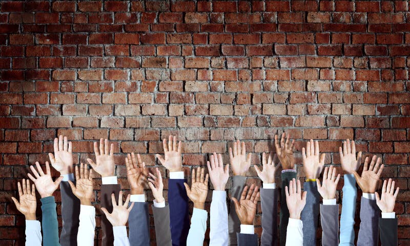 Diverse Business Hands Raised on Brick Wall Stock Photo - Image of ...