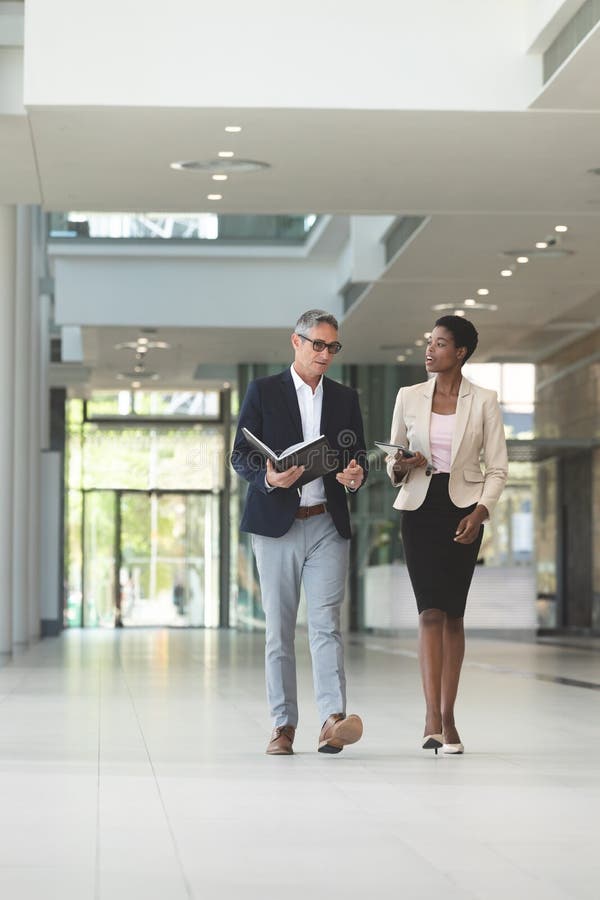 Diverse Business People Interacting with Each Other while Walking in ...