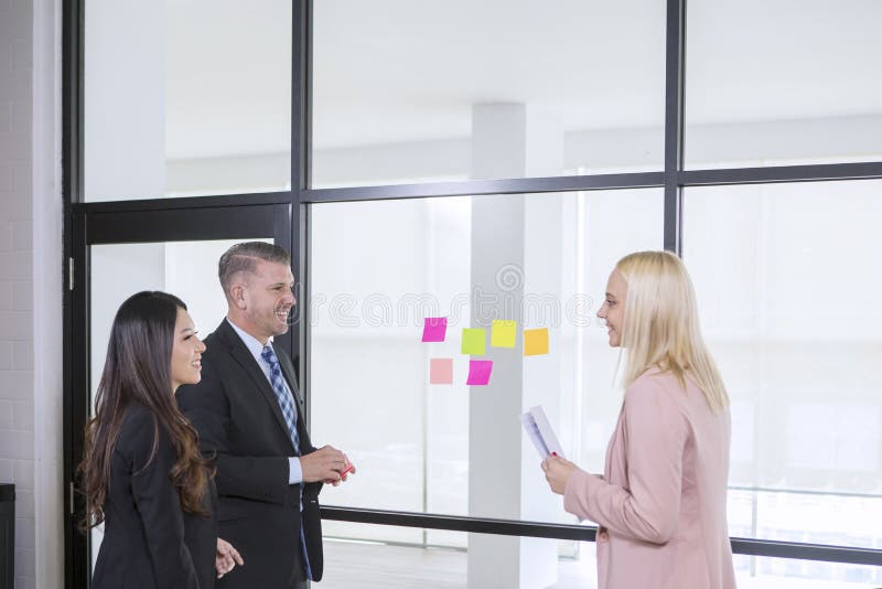 Diverse Business People Sharing Ideas on Sticky Notes Stock Image ...