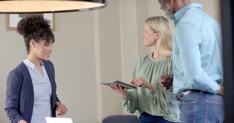 Diverse Business People Using Tablet at Conference Table with Copy ...