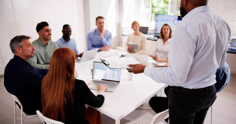 Diverse Business People Working and Communicating while Sitting Stock ...