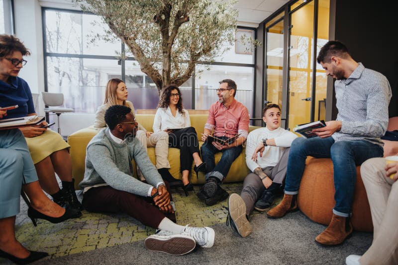 Multicultural Team in a Modern Office Collaboratively Discusses ... Multicultural Team in a Modern Office Collaboratively Discusses ...