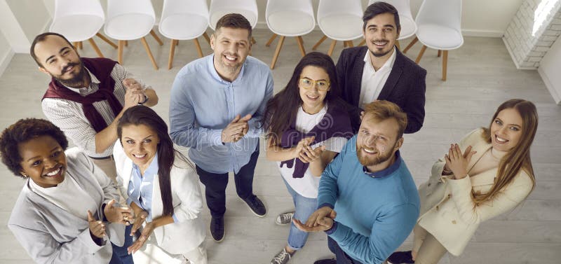 Multiethnic Team Of Happy Young Business People Standing In Office