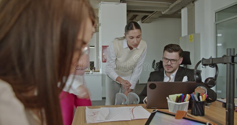 Business Team Collaboration: Diverse Professionals Working Together in a Modern Office on a ...