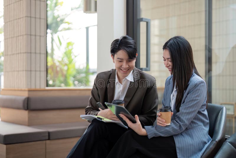 Diverse Business Team Collaborating on Project Plans and Analyzing Strategies in a Modern Office ...