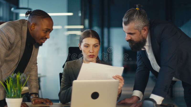 Diverse Business Team in a Modern Office Discussing Documents during a ...